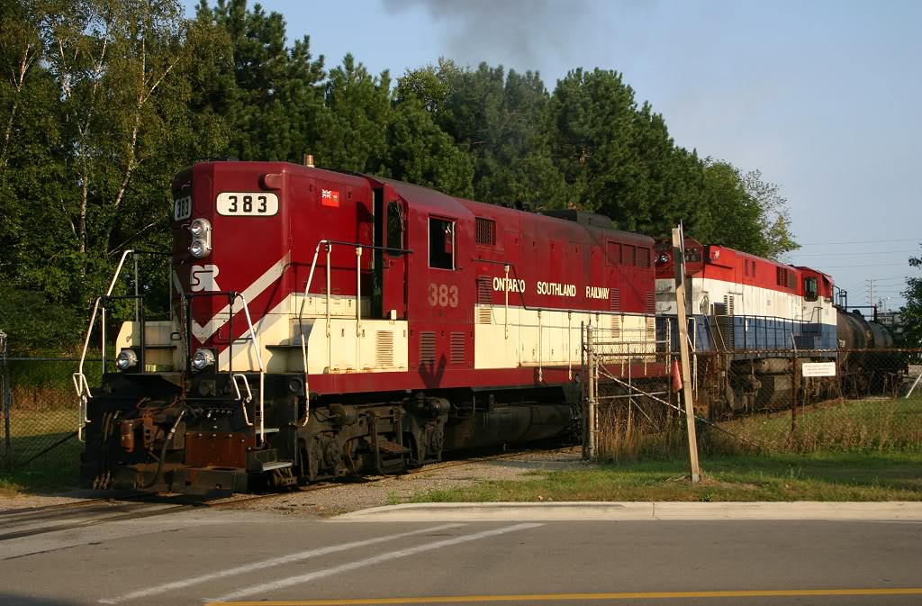 Railpictures.ca - Rob Eull Photo: OSR 383 and M420W 646 shove a long cut of empties back into ...