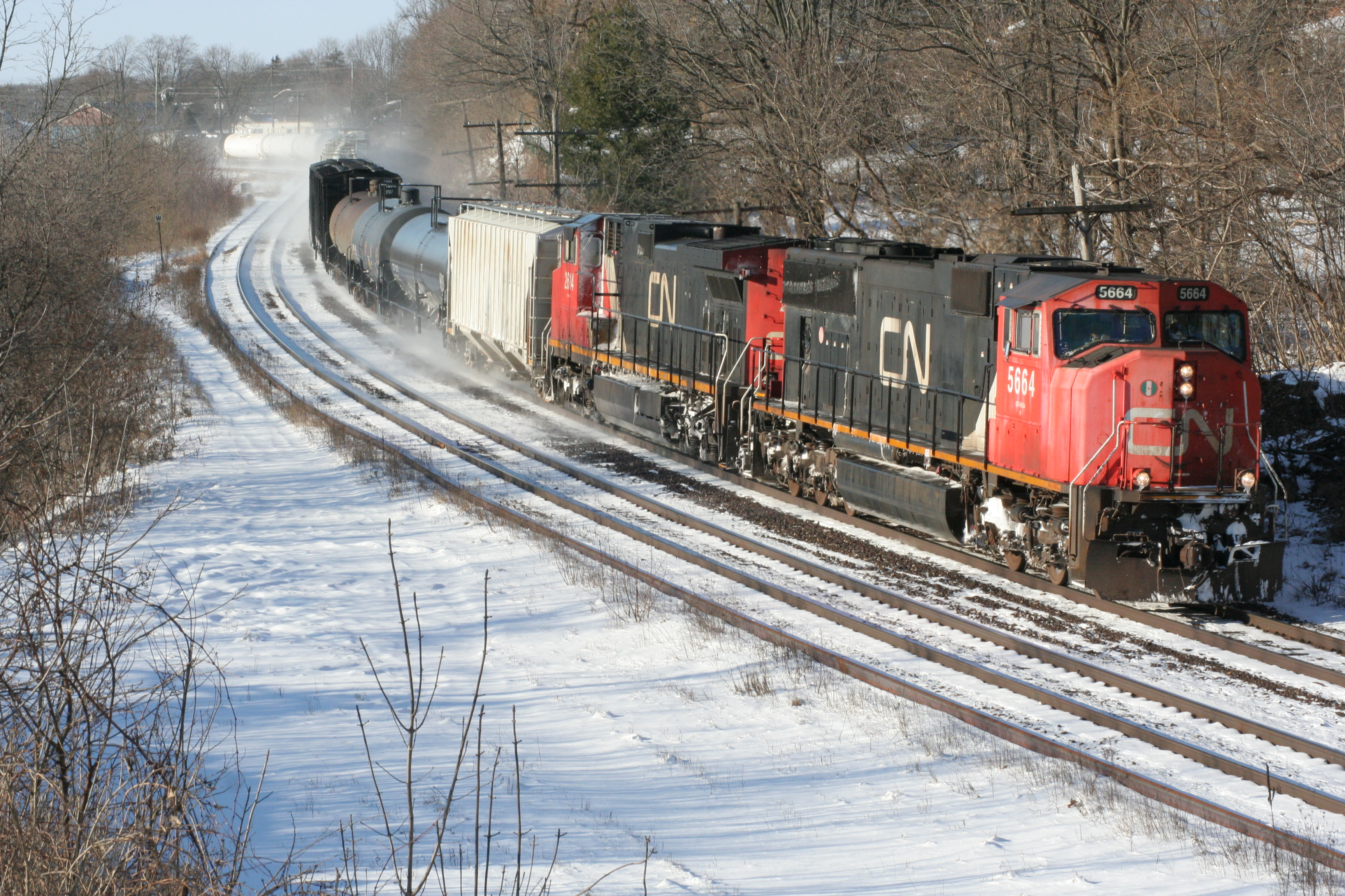 Railpictures.ca - Kevin Flood Photo: A CN eastbound freight (possibly CN 330) kicks up a bit of ...