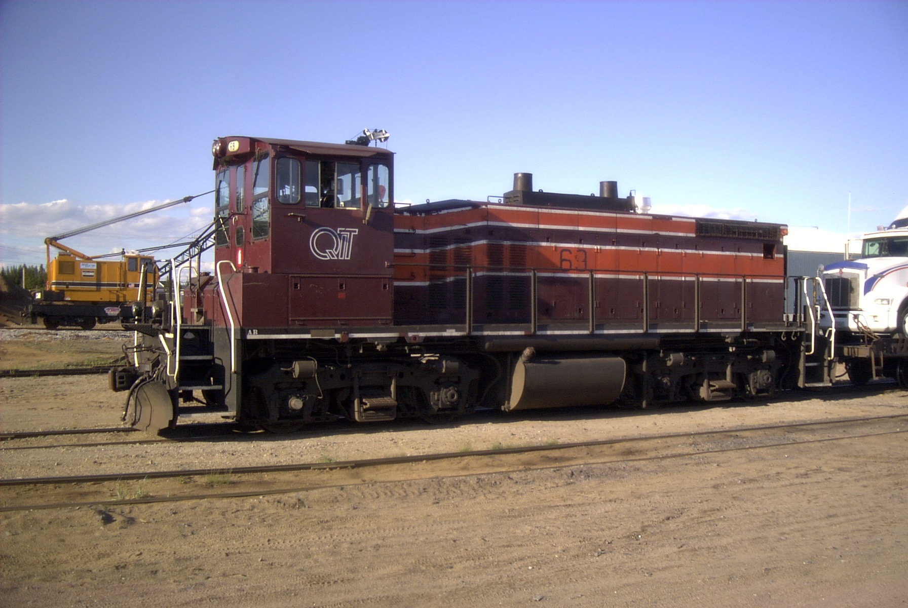 Railpictures.ca - Paul O'Shell Photo: QIT 69 gets ready to leave for the mine with a tractor ...