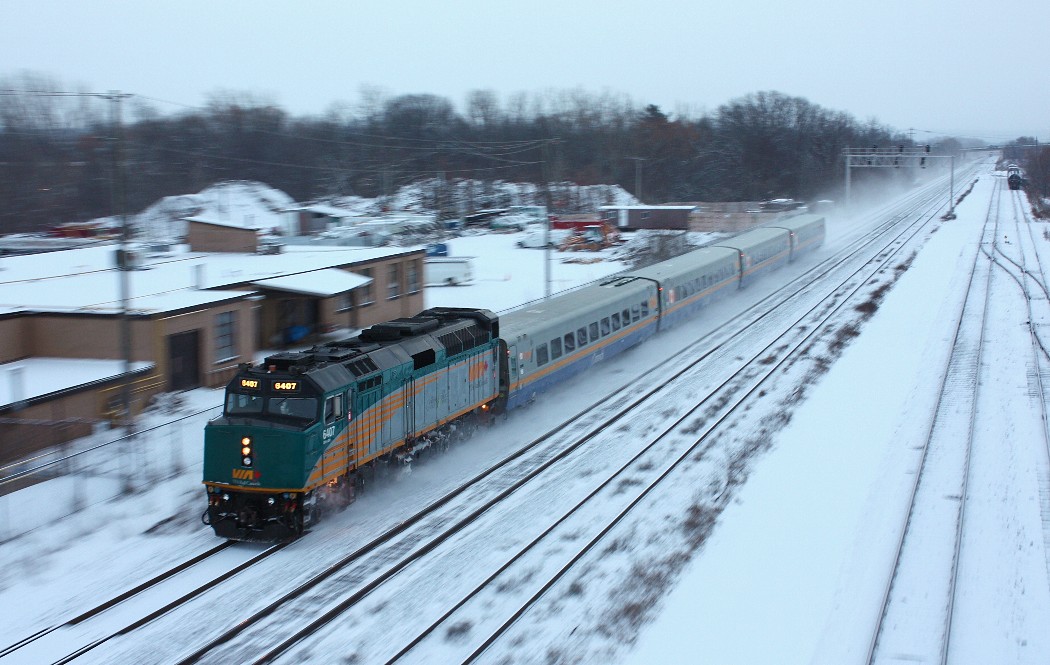 Railpictures.ca - Mark MacCauley Photo: Via 76 with 6407 kicks up the freshly laid snow, just ...