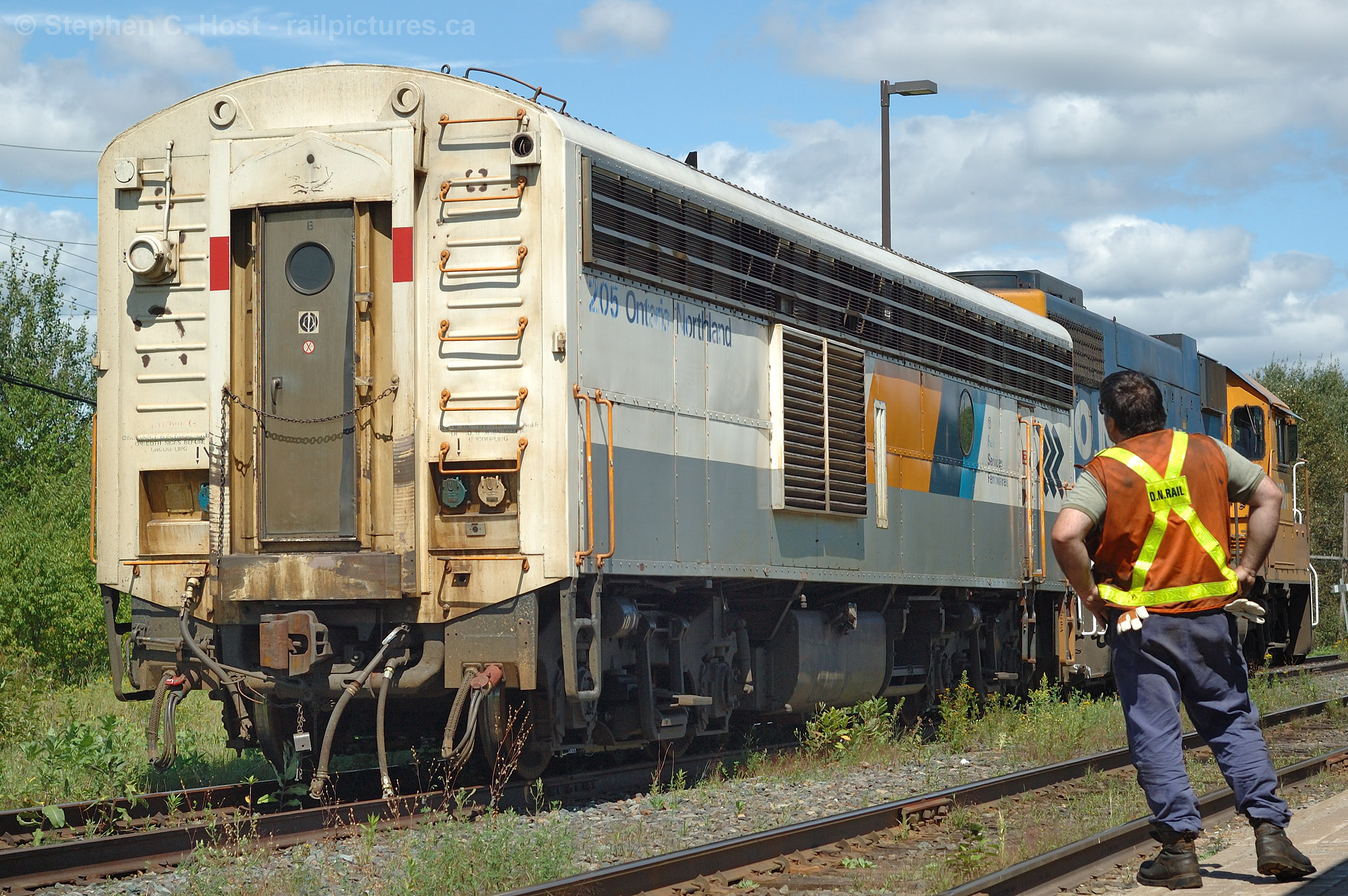 Railpictures.ca - Stephen C. Host Photo: A hostler from O.N. Rail (per Vest) looks over Train ...