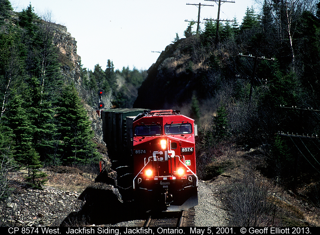 Railpictures.ca - Geoff Elliott Photo: CP 8574 West passes through the rock cut and leans into ...