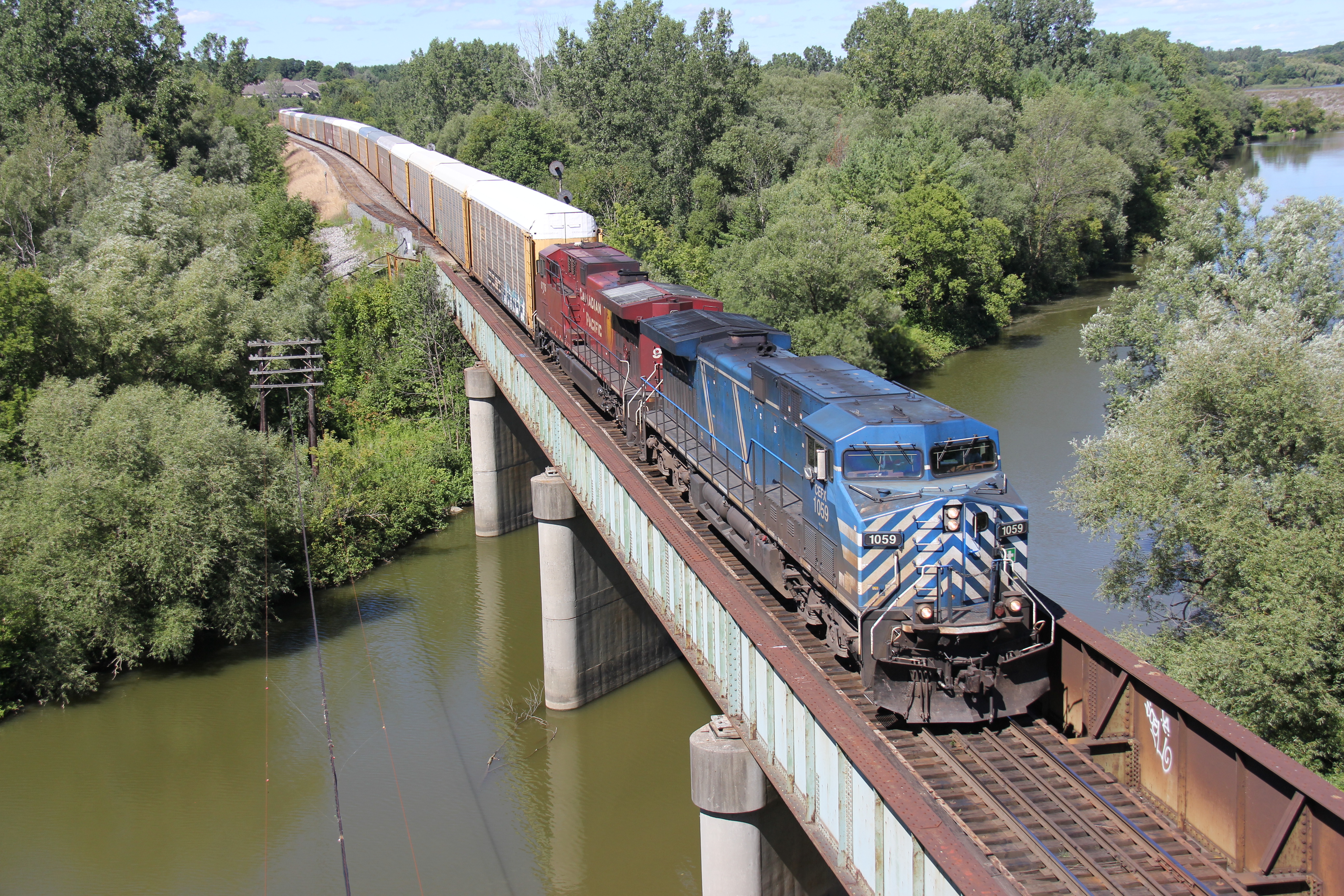 Railpictures.ca - Kevin Flood Photo: CP 147 with a bluebird in the lead heads west under blue ...