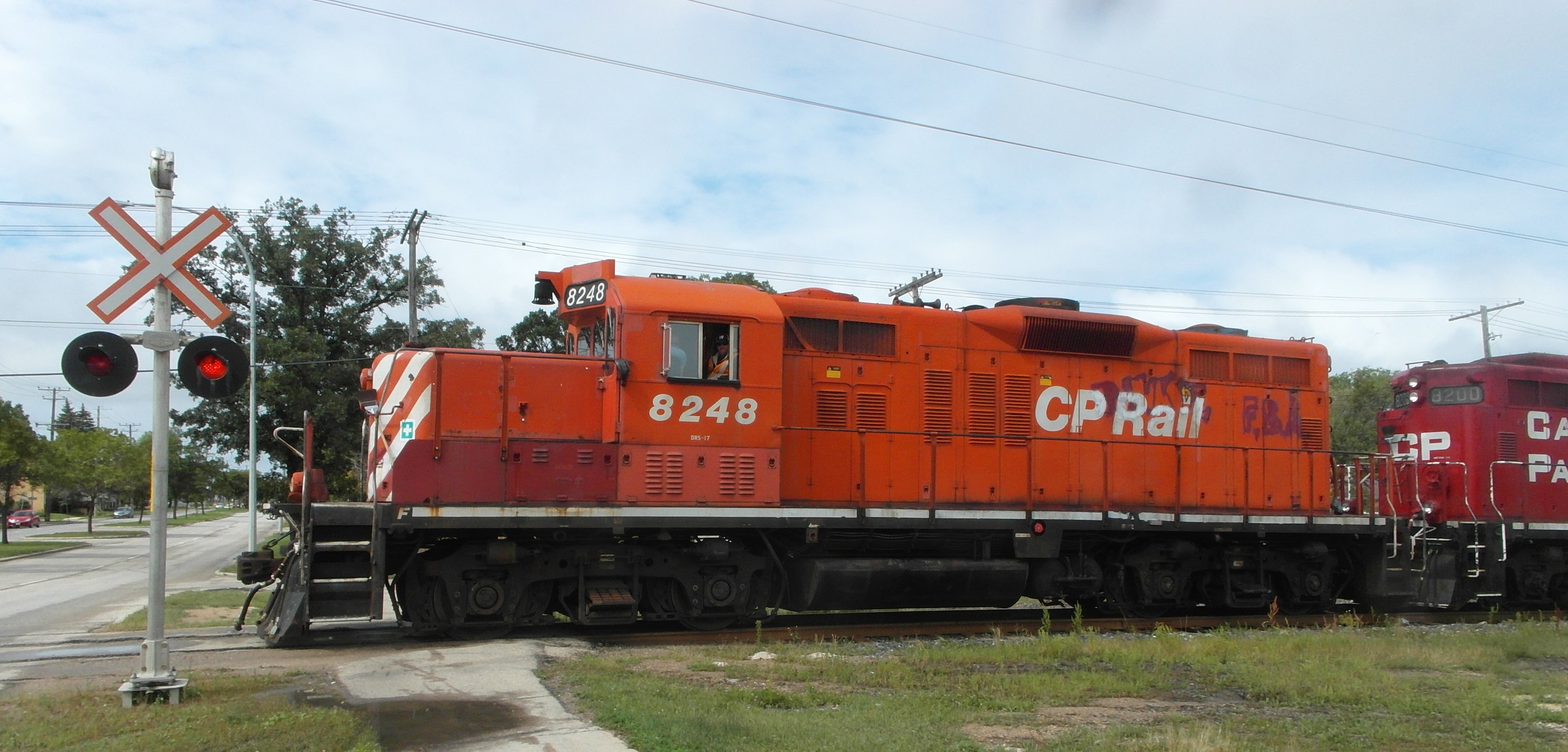 Railpictures.ca - Taylorover9001 Photo: CP 8248 (GP9u) and CP 8200 (GP9u) cross Taylor Ave, with ...