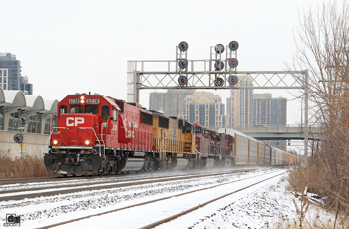Railpictures.ca - JA Photo: CP 6238, UP 3984, CP 9833 & CP 8533 , kicks up snow as it motors ...