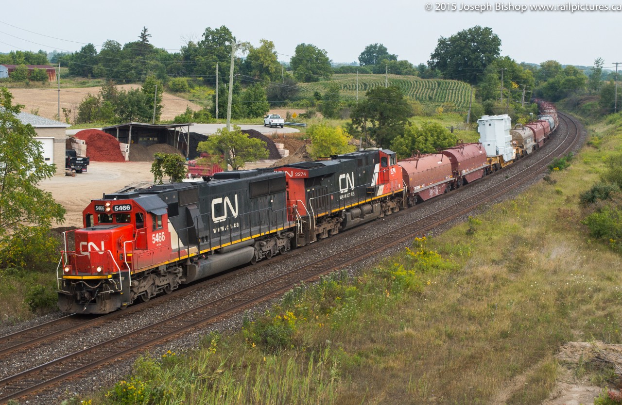 Railpictures.ca - Joseph Bishop Photo: CN M33131-31 leans into the curve at Garden Ave with CN ...