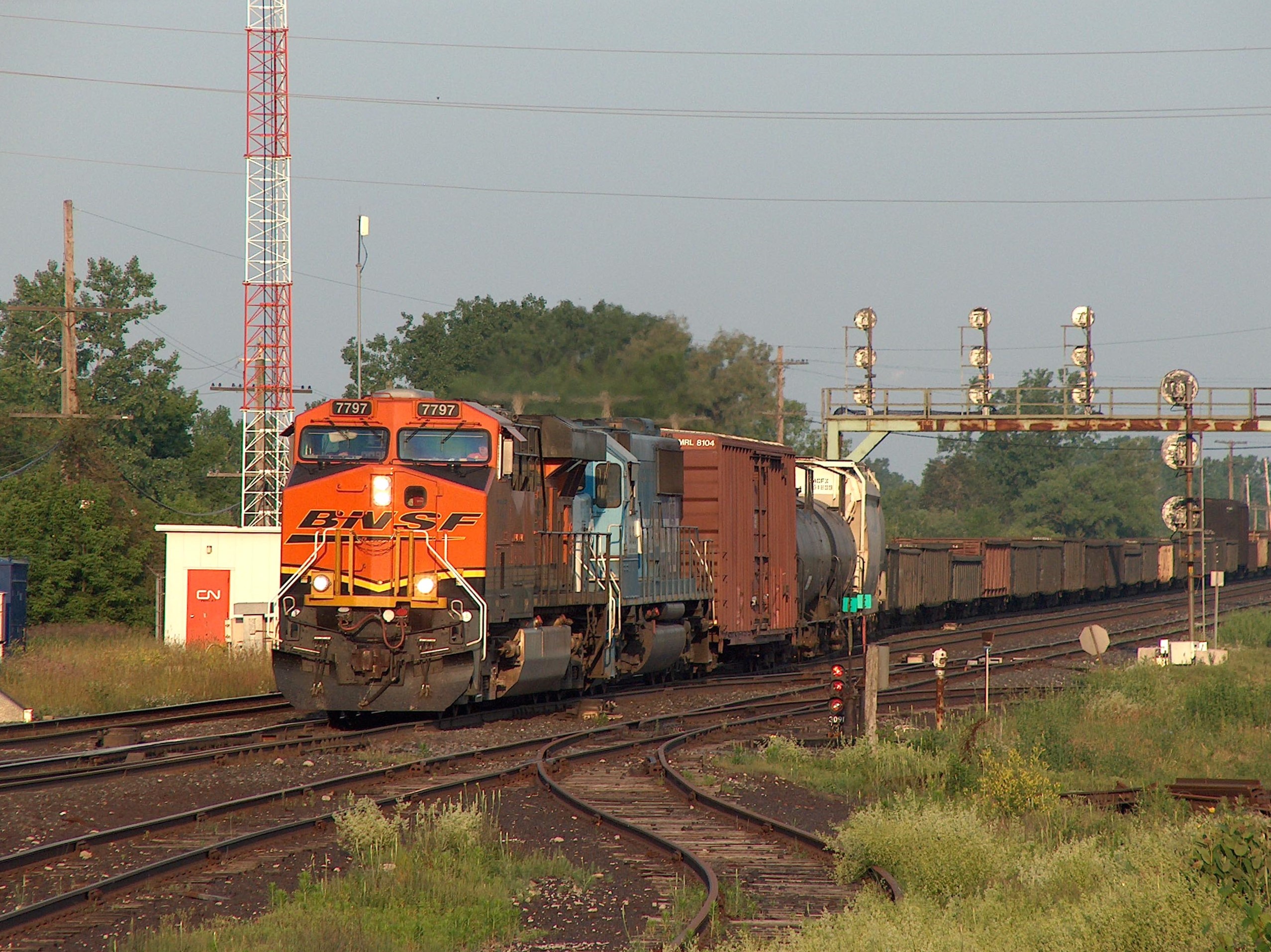 Railpictures.ca - Kevin Flood Photo: BNSF 7797 and an EMD locomotive trailing (in that EMD paint ...