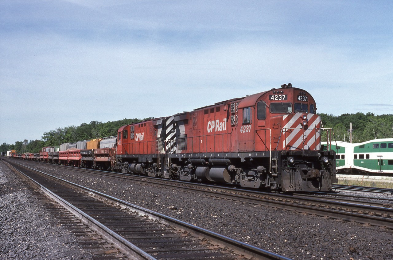Railpictures.ca - David J Parker Photo: A CP work train consisting of air-dump ballast cars sits ...