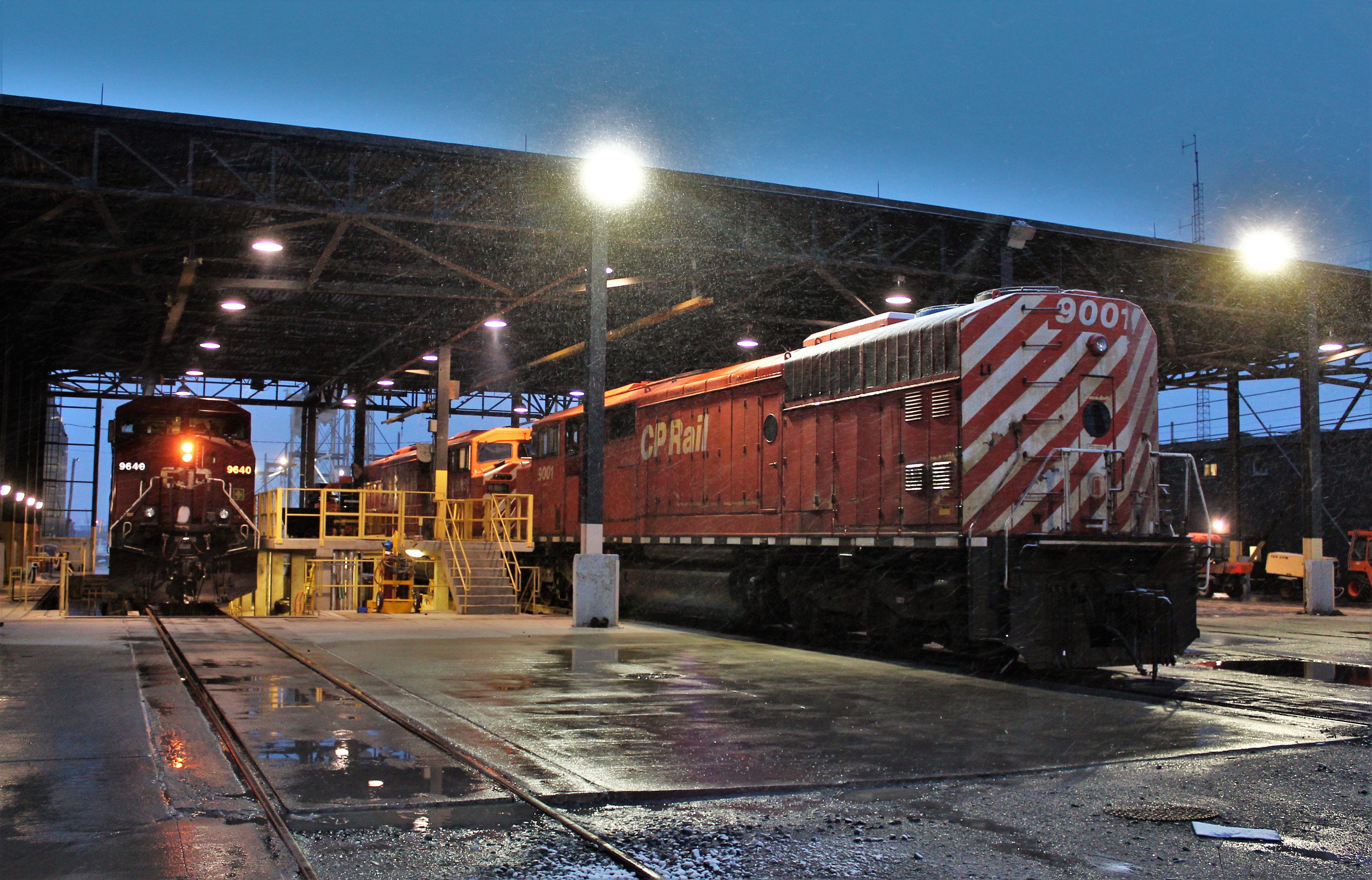 Railpictures.ca - Paul Santos Photo: While an AC4400 (9640) gets some quick repairs done so it ...