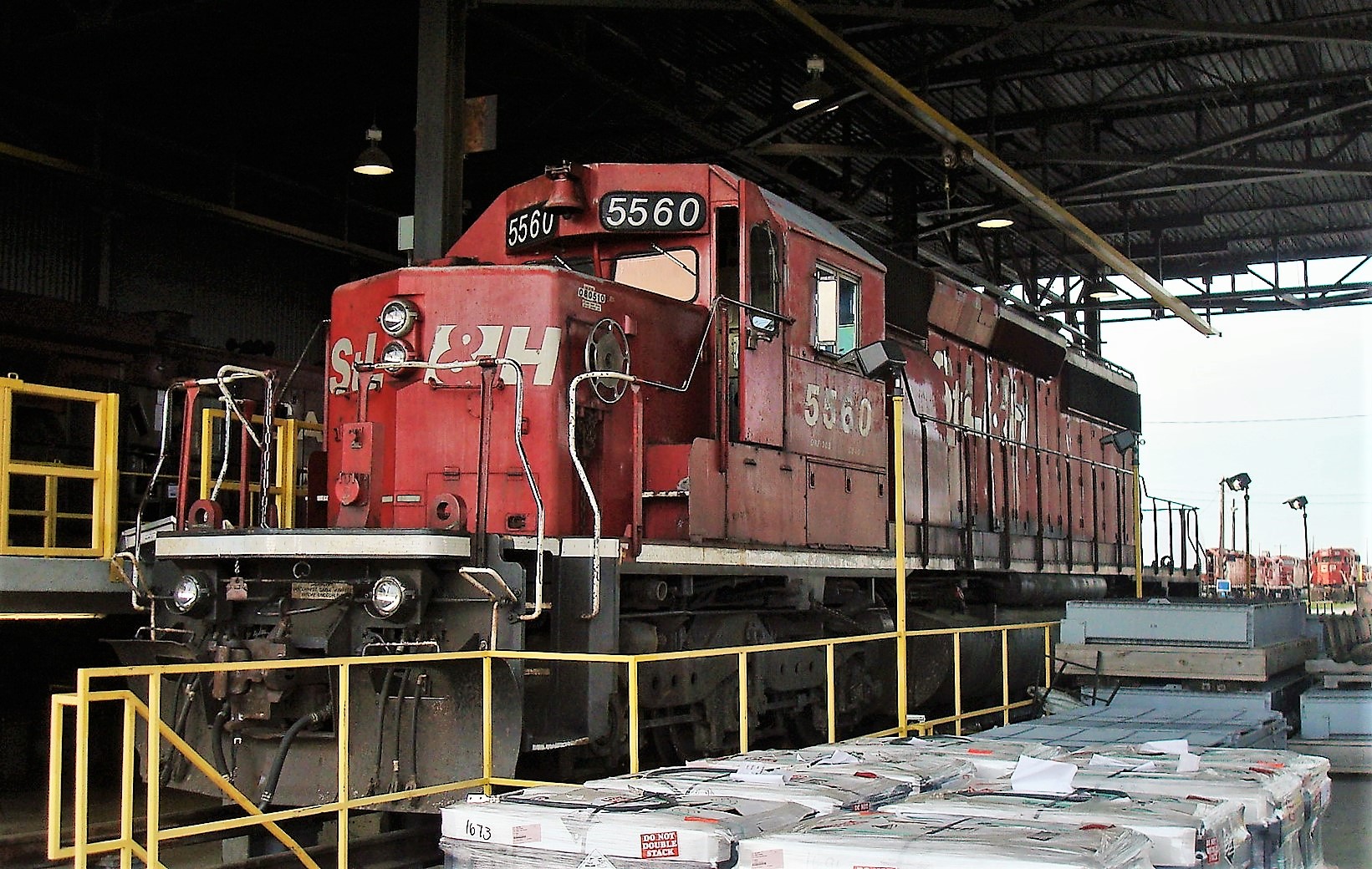 Railpictures.ca - Paul Santos Photo: Awaiting repairs under the carport is STL&H 5560. It was ...