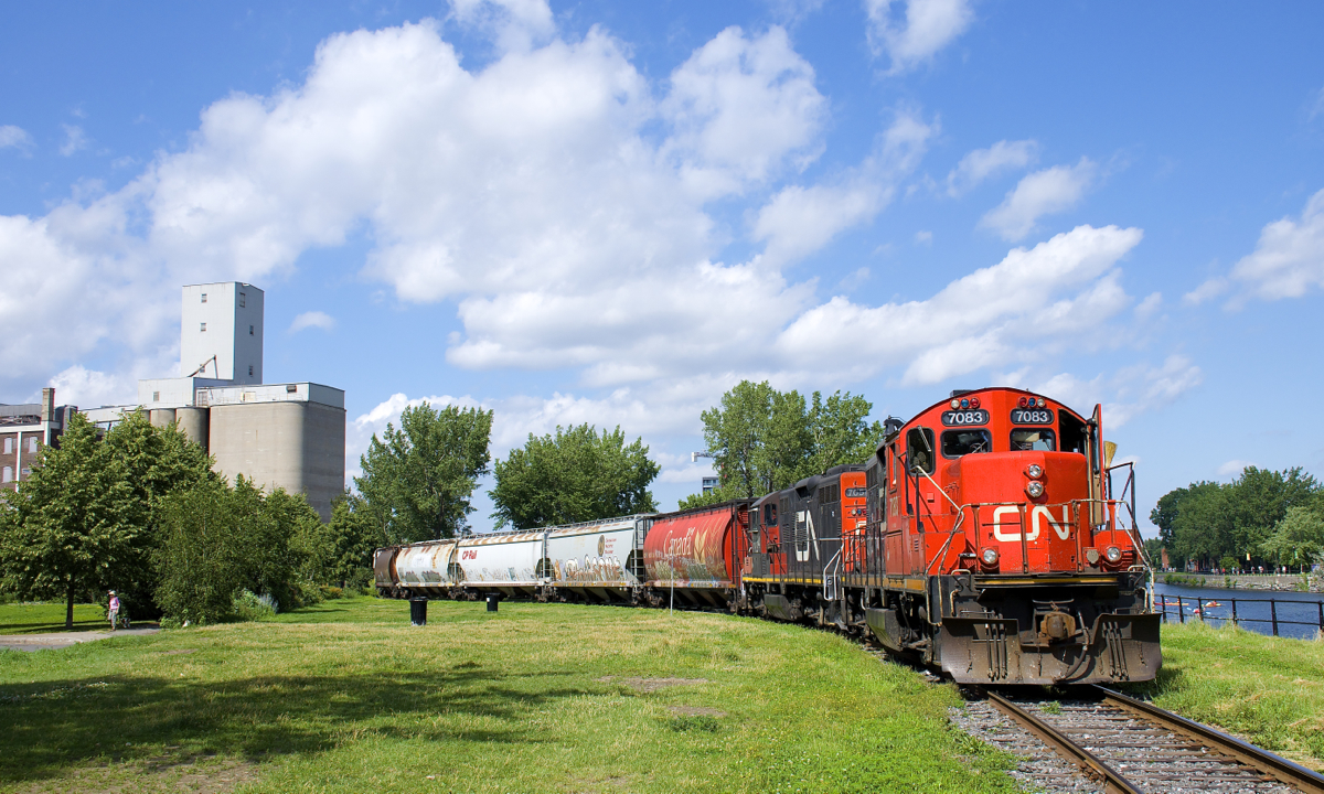 Railpictures.ca - Michael Berry Photo: CN 7083 & CN 7054 shove eight cars grain cars into the ...