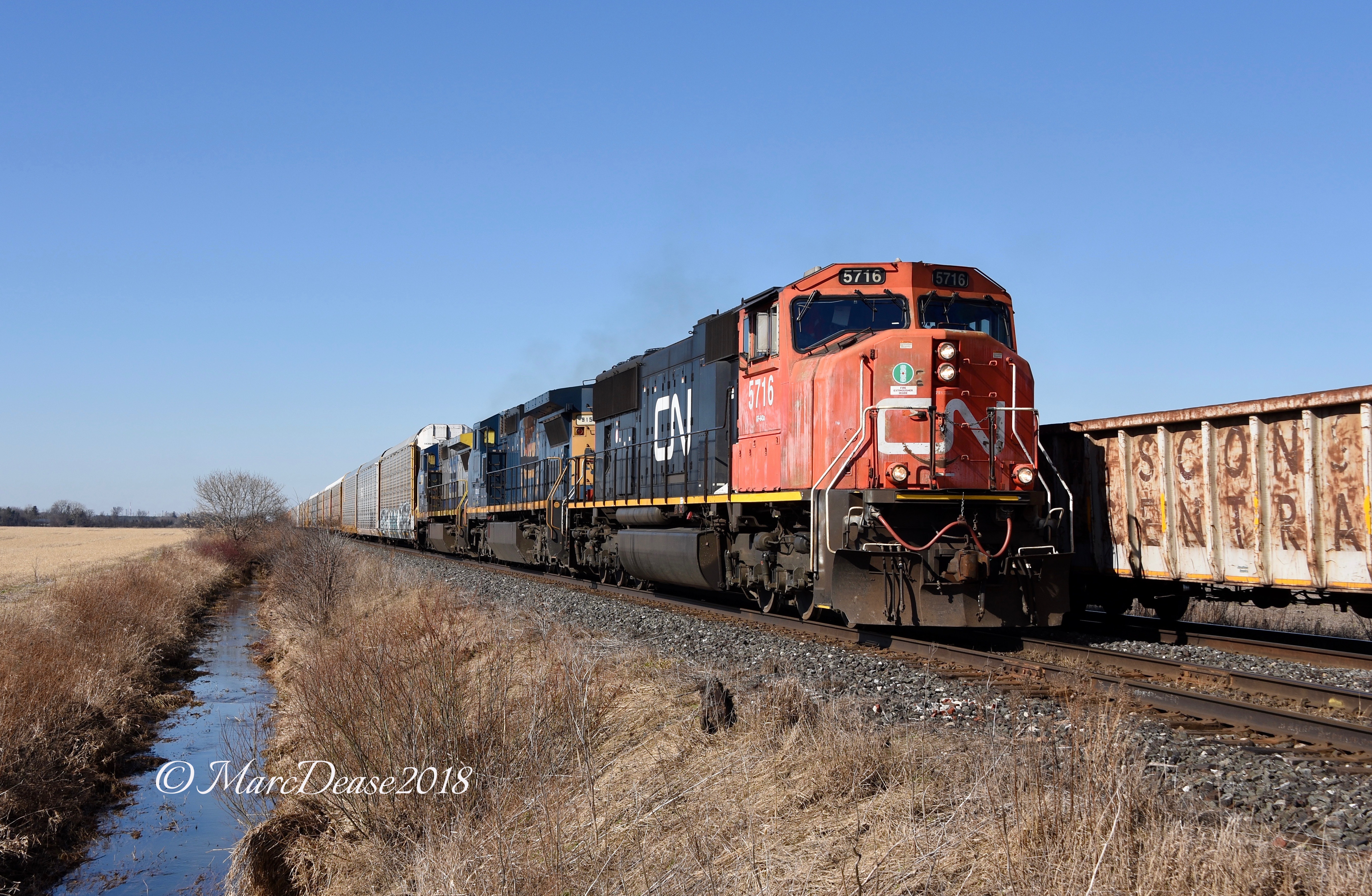 Railpictures.ca - Marc Dease Photo: CN 5716 with GECX 9150 and GECX 7354 meet train 385 at ...