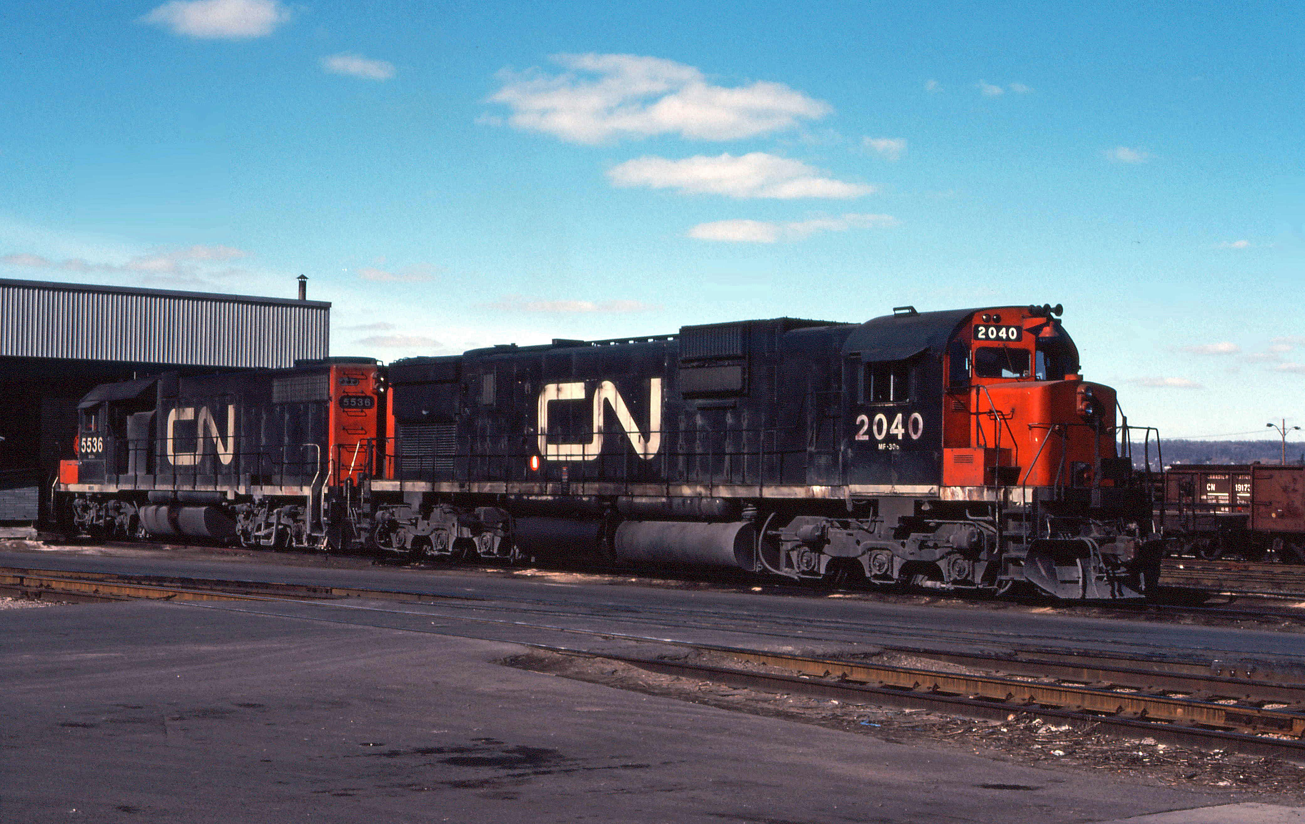 Railpictures.ca - Doug Page Photo: CN C630m 2040 and GP38-2 5536 rest in the sunshine outside ...