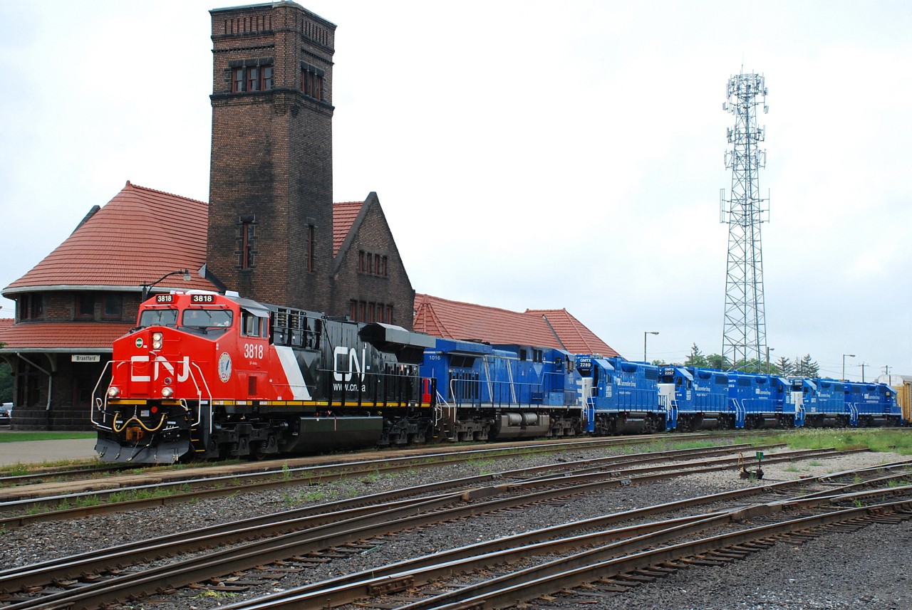 Railpictures.ca - Rob Smith Photo: CN 394 curves past the station with fairly new CN 3818, CEFX ...