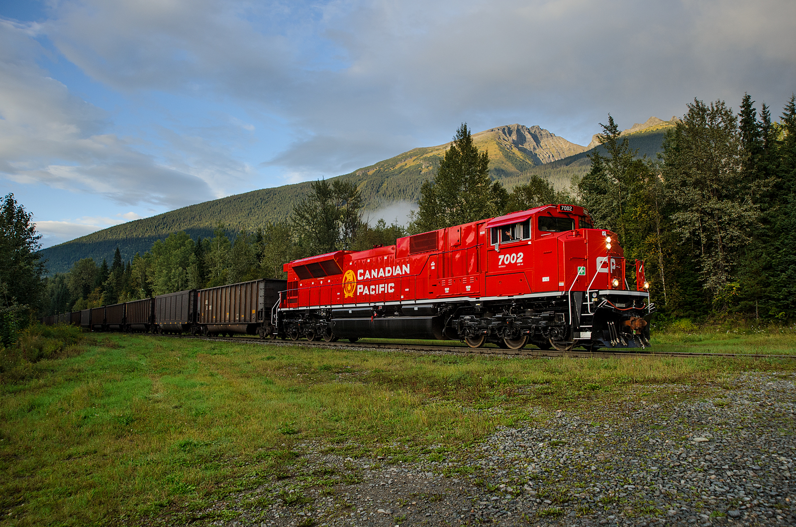 Railpictures.ca - Tim Stevens Photo: CP SD70ACU 7002 leads empty CN coal train C741 downhill ...