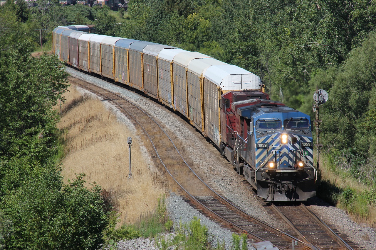 Railpictures.ca - Kevin Flood Photo: A CP westbound led by CEFX 1059 is pictured leaving Coakley ...
