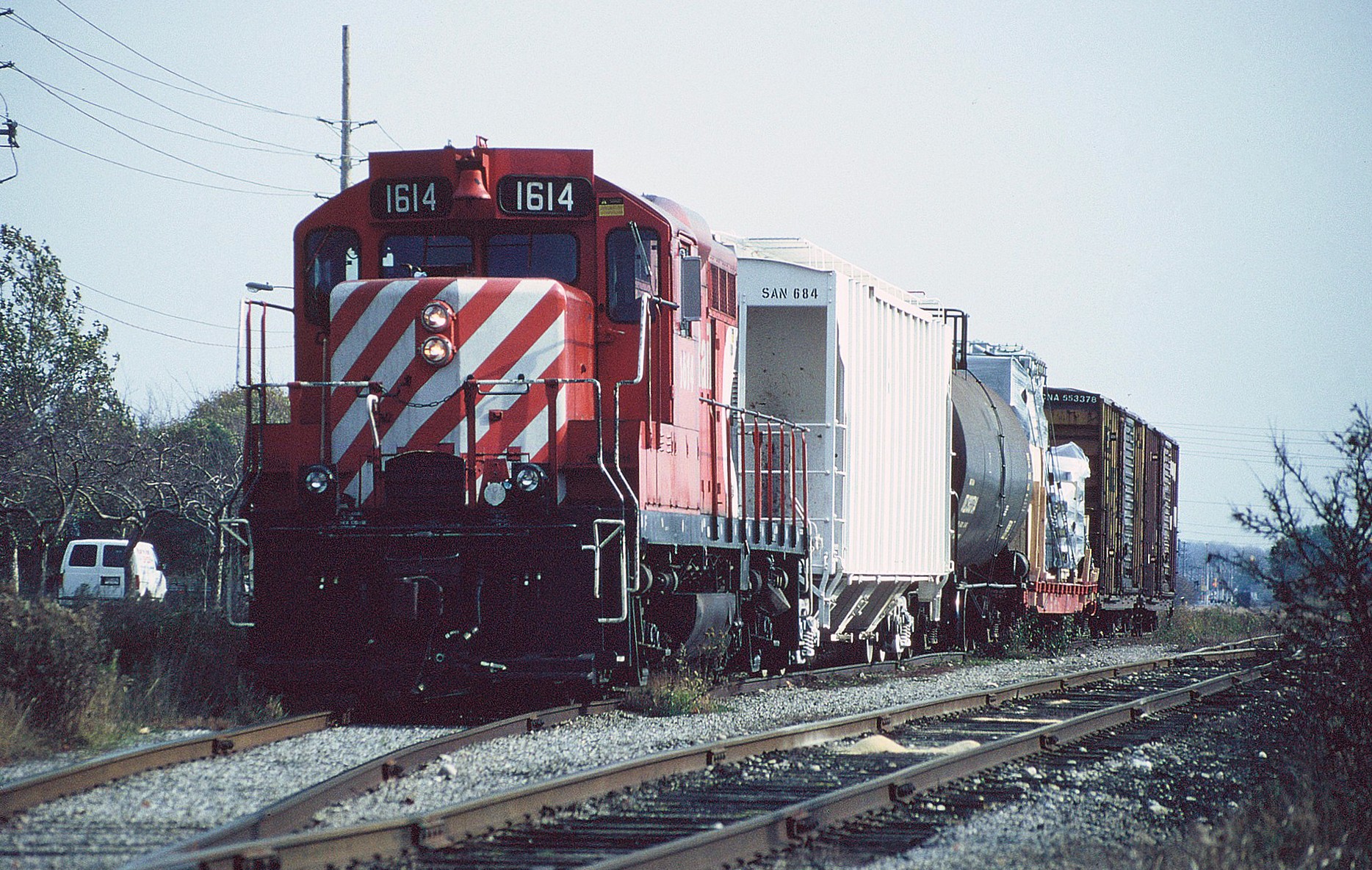 Railpictures.ca - Jason Noe Photo: Following its lifting of two boxcars, CP GP9u 1614 is seen ...