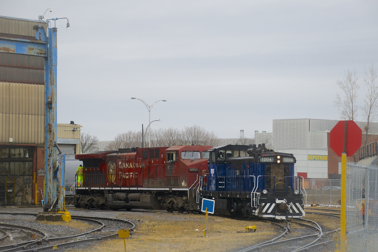 Railpictures.ca - Michael Berry Photo: A GMD-1 is shoving CP 8531 into the shops at CAD on a ...