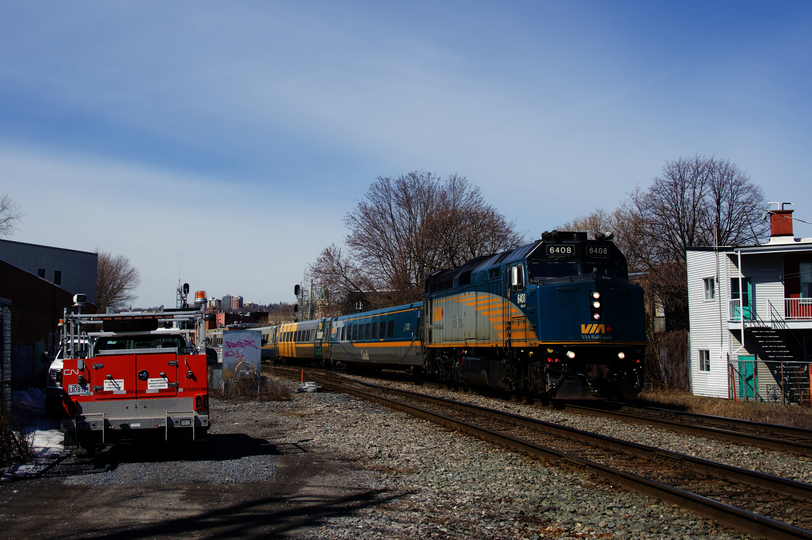 Railpictures.ca - Michael Berry Photo: VIA 60 from Toronto is passing a couple of CN trucks at ...