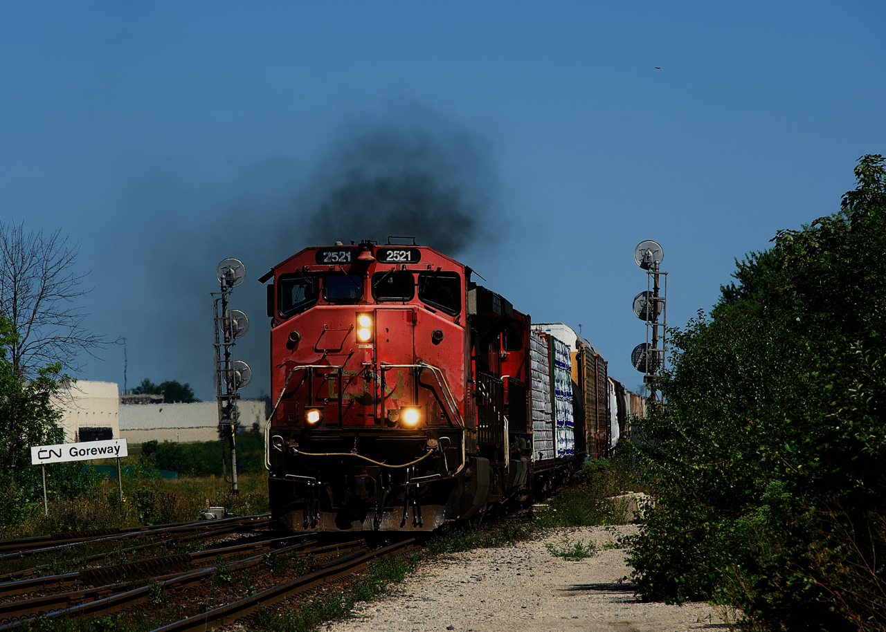 Railpictures.ca - Michael Berry Photo: A smokey Dash9-44CWL leads CN 435 past Goreway ...
