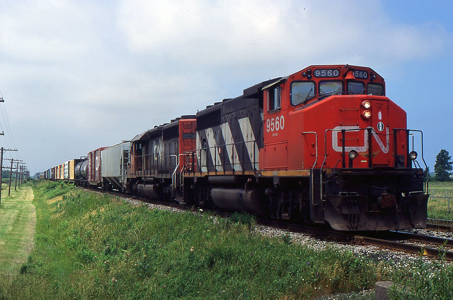 Railpictures.ca - Dean Brown Photo: CN 449 with CN GP40-2(W) 9560 and CN SD40-3 6014 passing ...