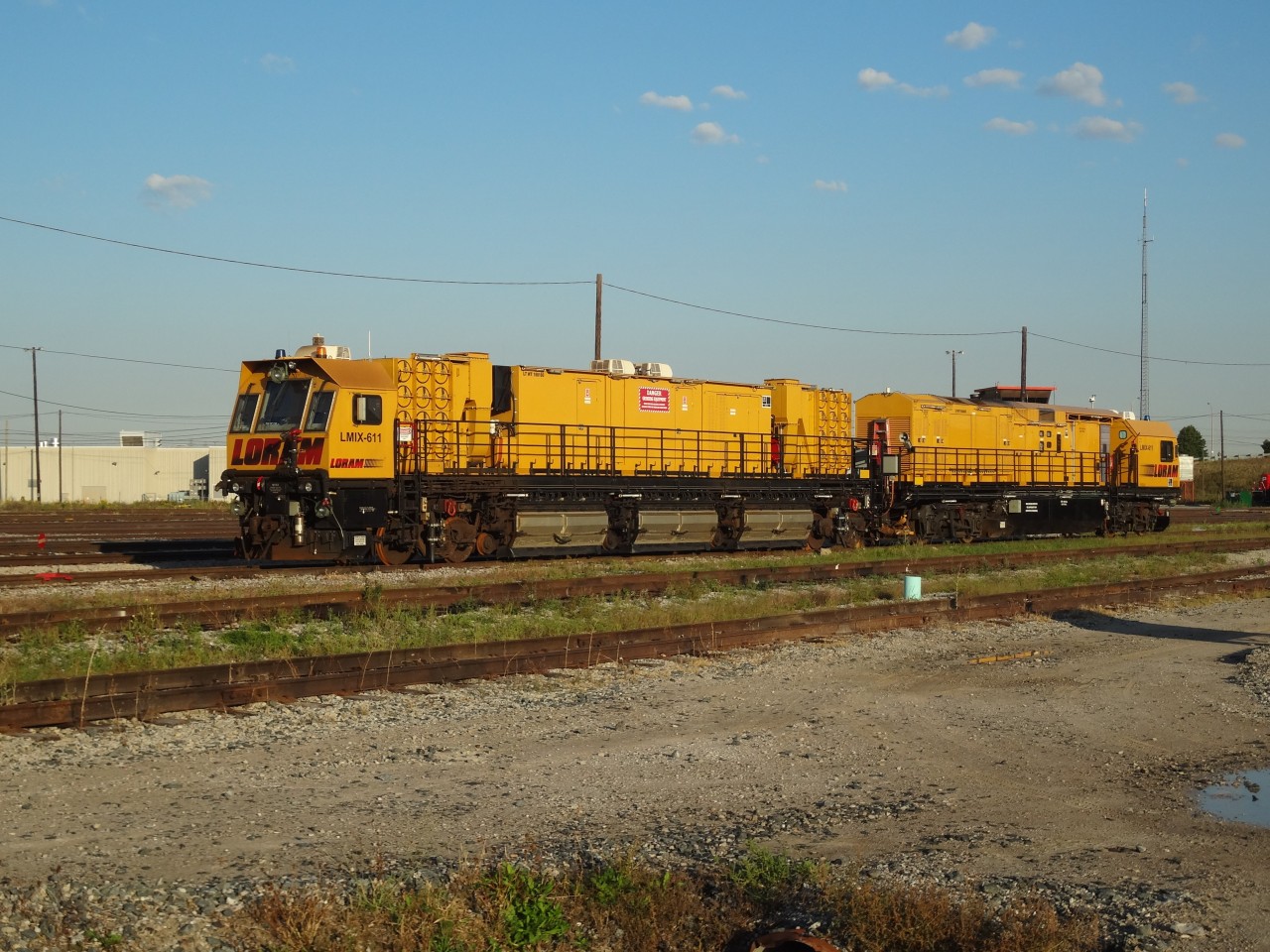 Railpictures.ca - Paul O'Shell Photo: LMIX 611 Loram 2-unit rail grinder basks in the warm ...