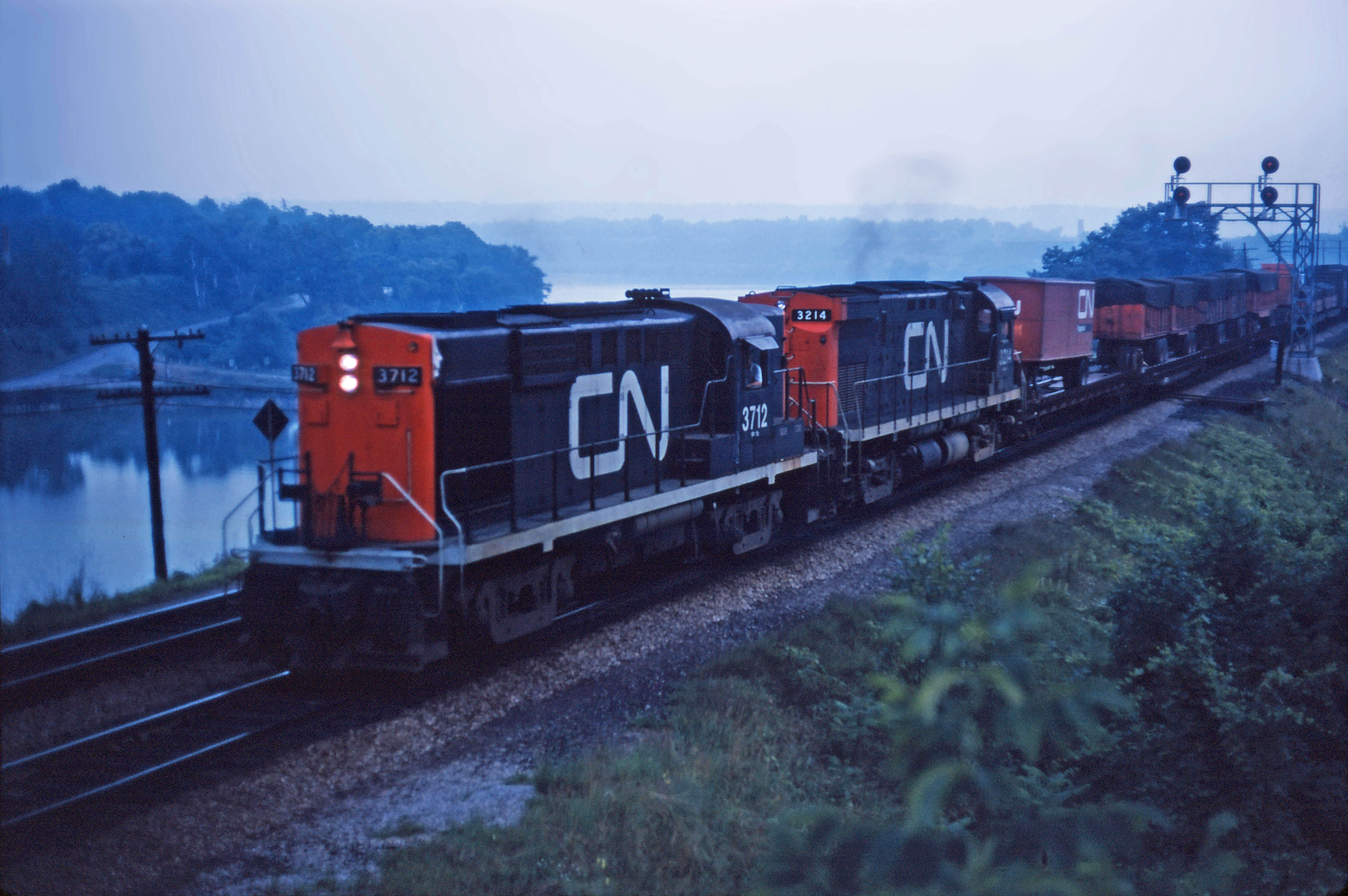 Railpictures.ca - Doug Page Photo: At dusk, CN RS18 3712 and C424 3214 ...
